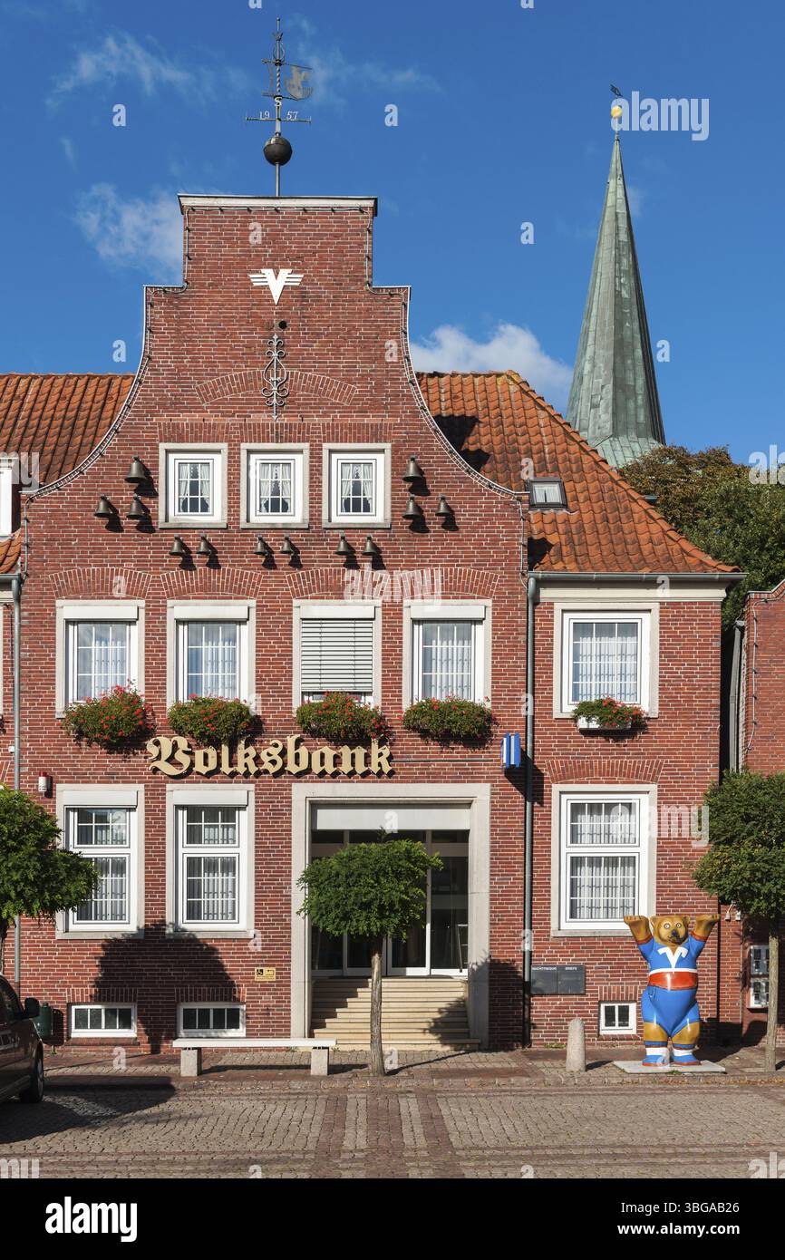 Frontal view of a brick facade of the Volksbank building with carillon ...
