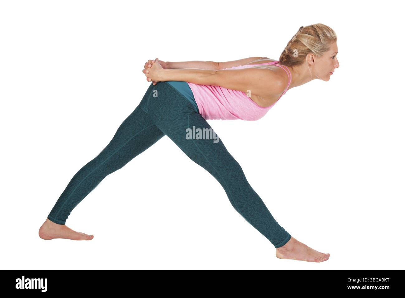 Full body side view of a young woman in the yoga position leaning ...
