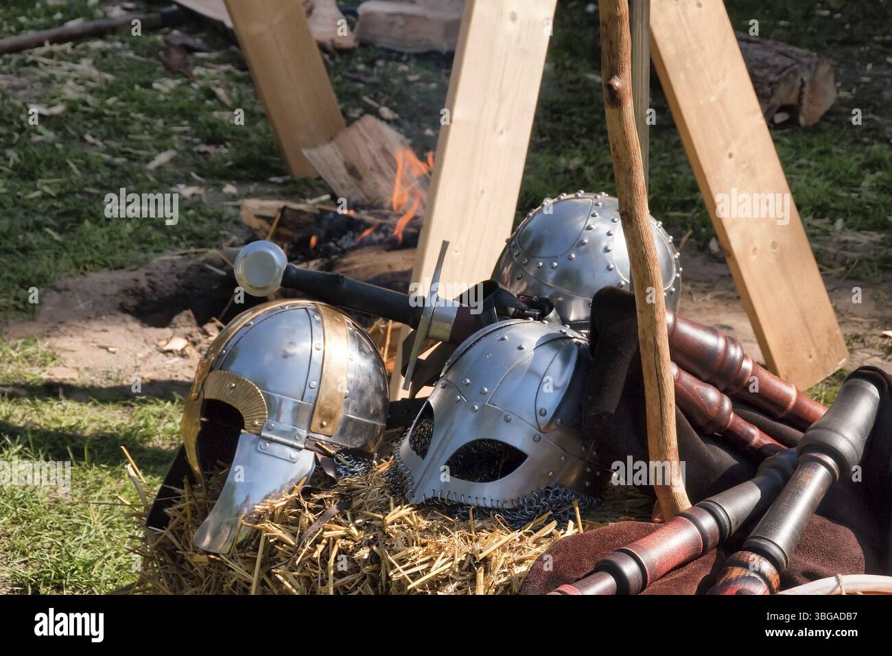 Medieval helmets and weapons Stock Photo - Alamy
