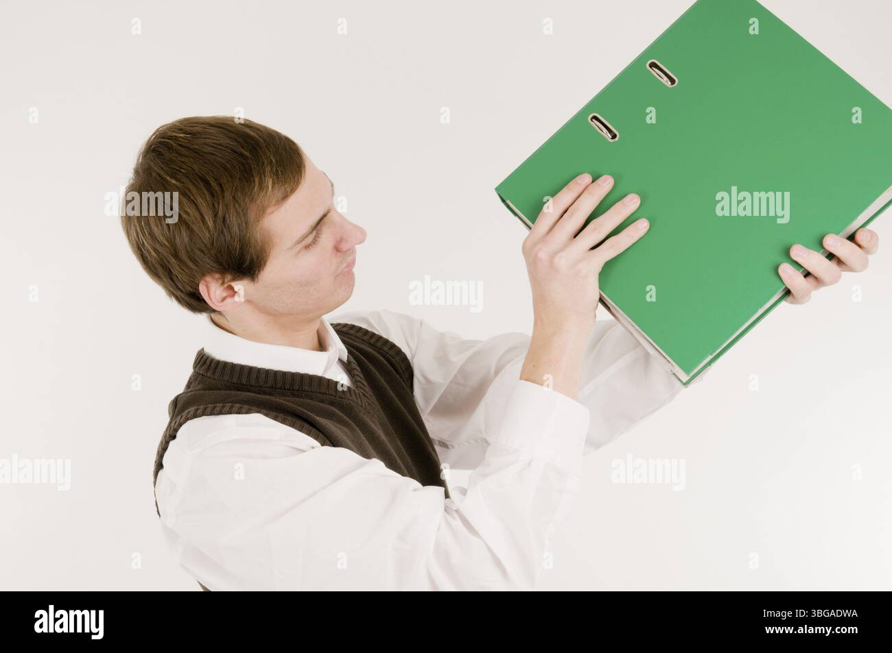 Side view of the upper body of an accountant with a scrutinising look ...