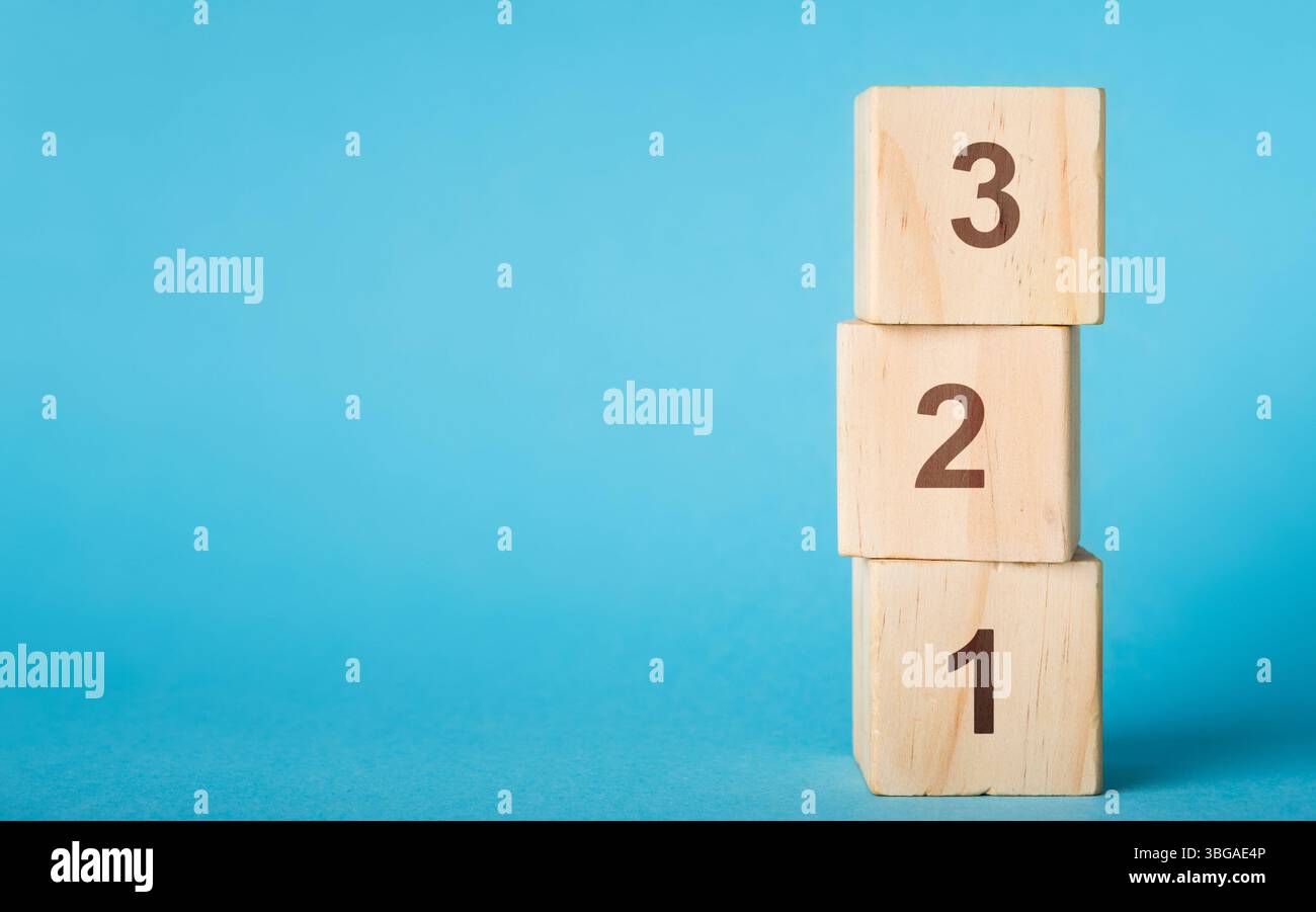 Wooden alphabet number blocks 123 on blue background Stock Photo - Alamy