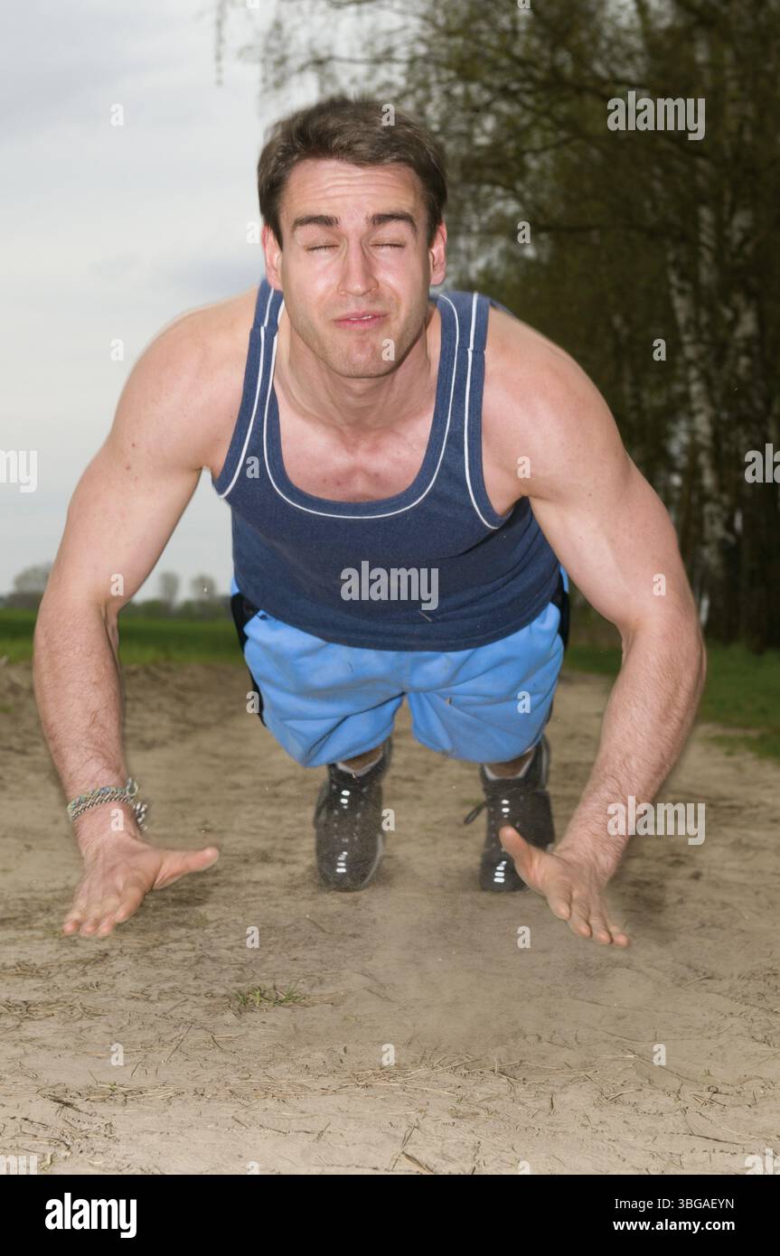 Frontal full-body shot of a man facing the camera in short blue ...