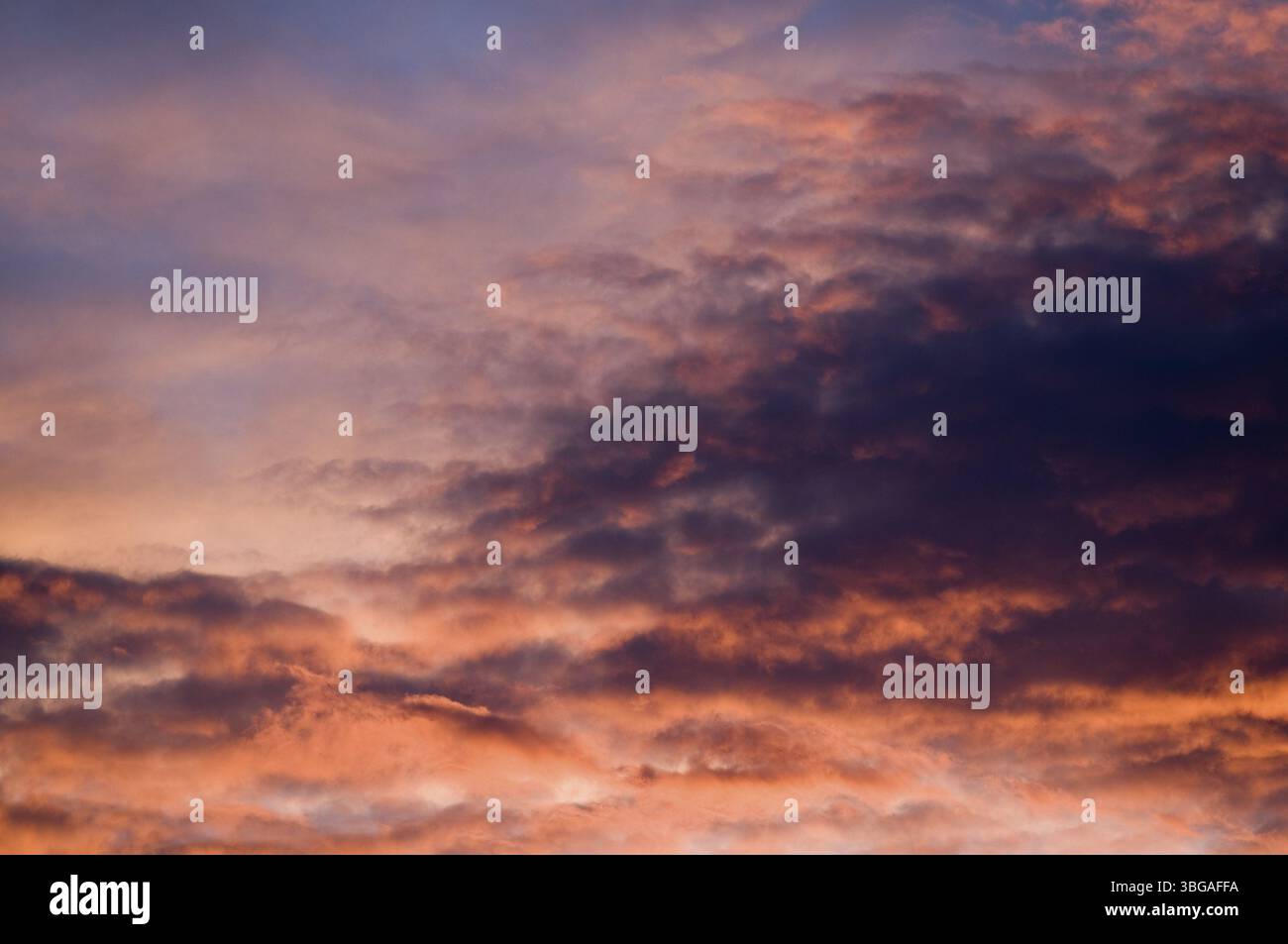 Full-format view of an atmospheric sky with clouds in the evening light ...