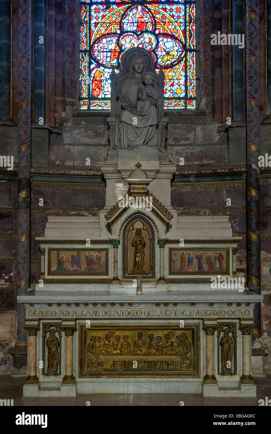 Ornate altar features golden tabernacle and marble statue of Virgin ...