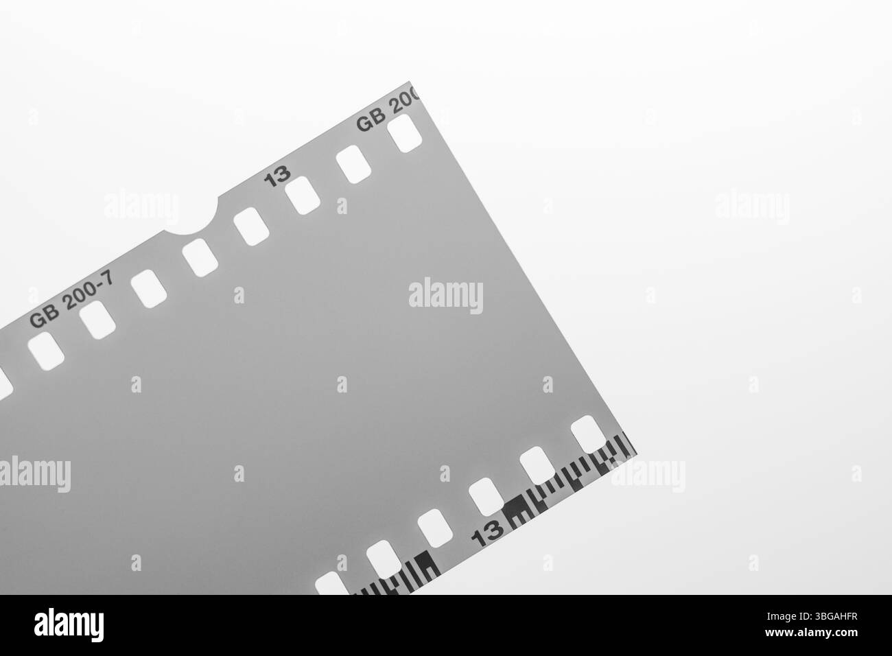 Blank monochrome 35mm Film Strip with Frame Number 13 and Code on White ...