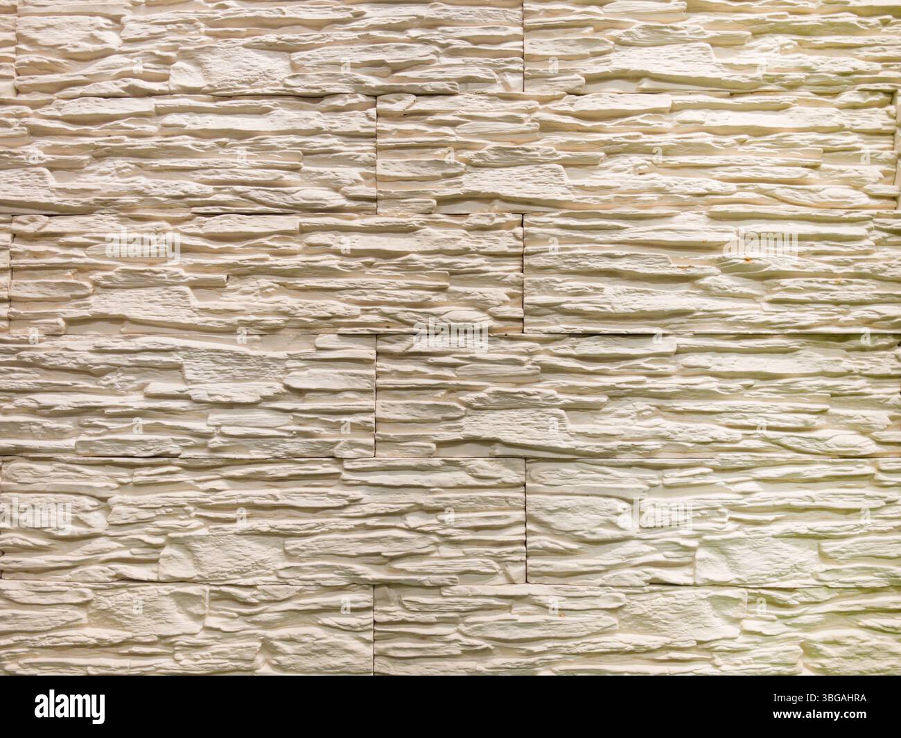 Textured decorative tiles adorn a modern interior wall, providing a ...