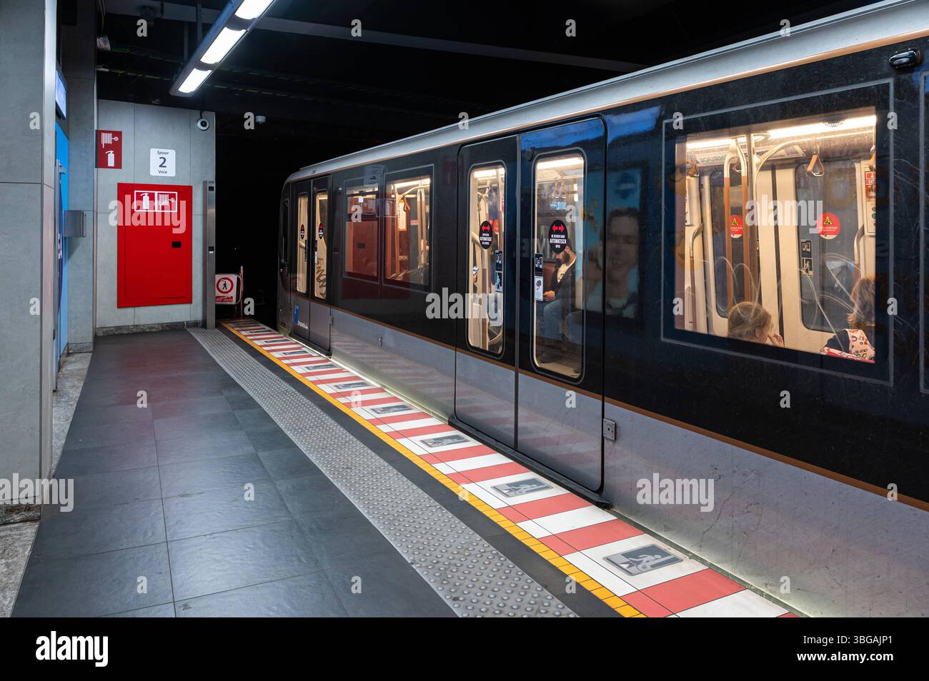 Metro carriage departing at the De Brouckere MIVB STIB underground ...