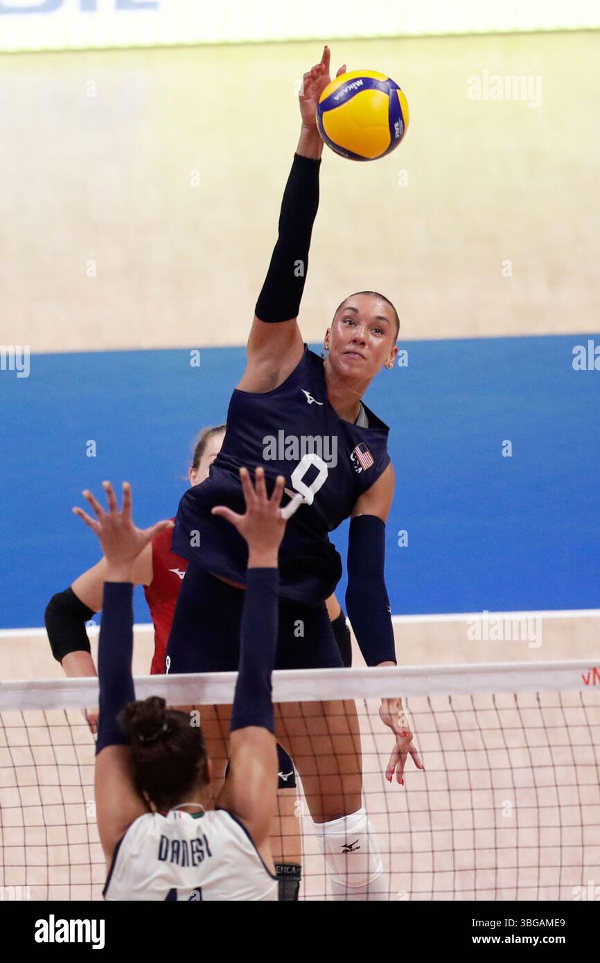 Madisen Skinner of the US spikes the ball during a Women's Volleyball ...