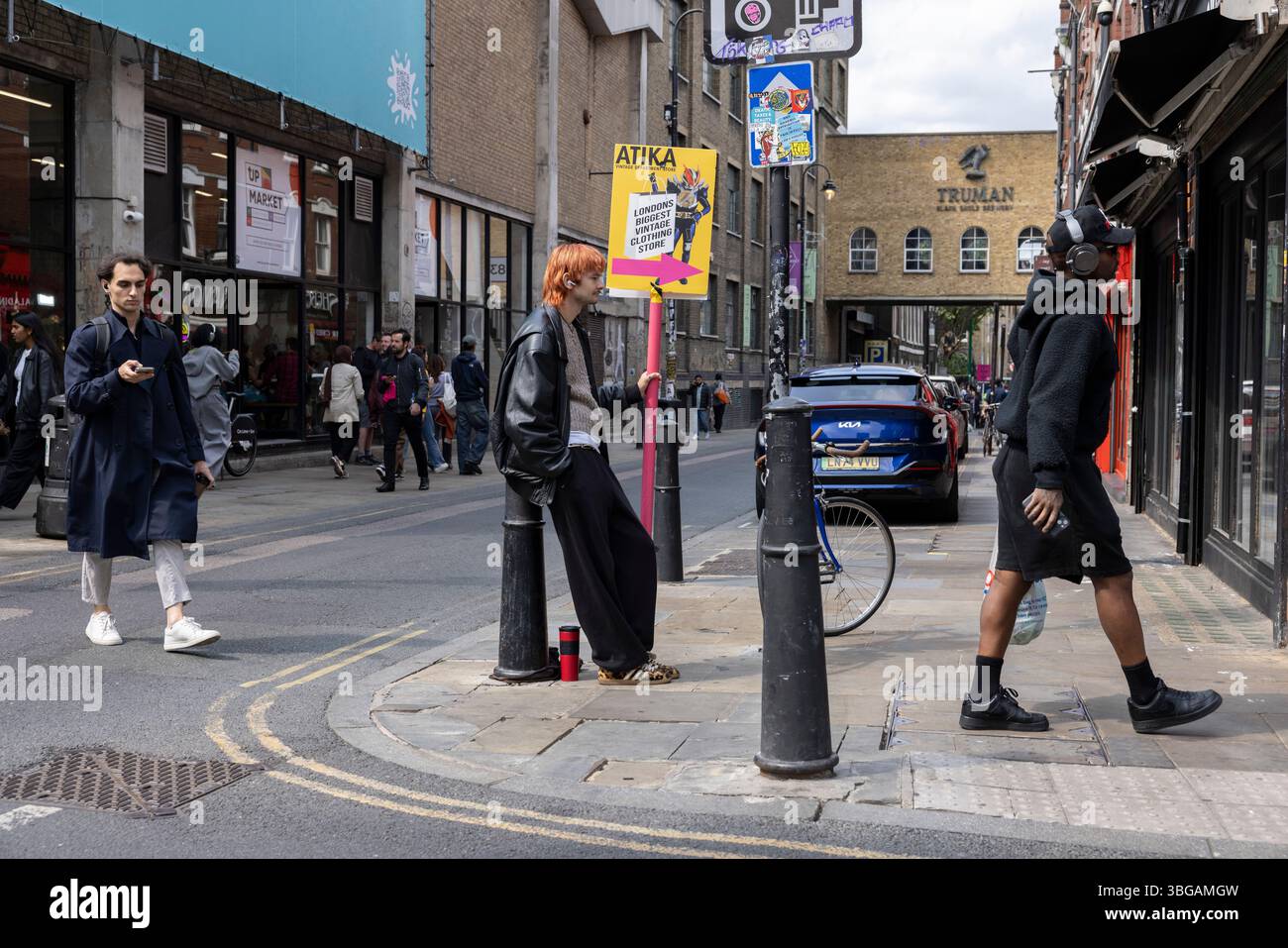 Brick Lane, in London's hip East End, vibrant street art, vintage shops ...