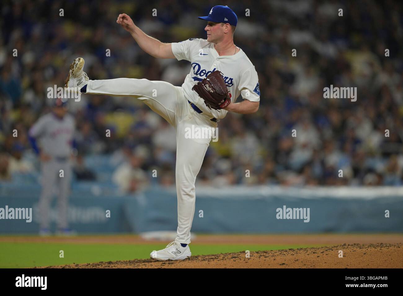 Los Angeles Dodgers relief pitcher Ben Casparius delivers to the plate ...