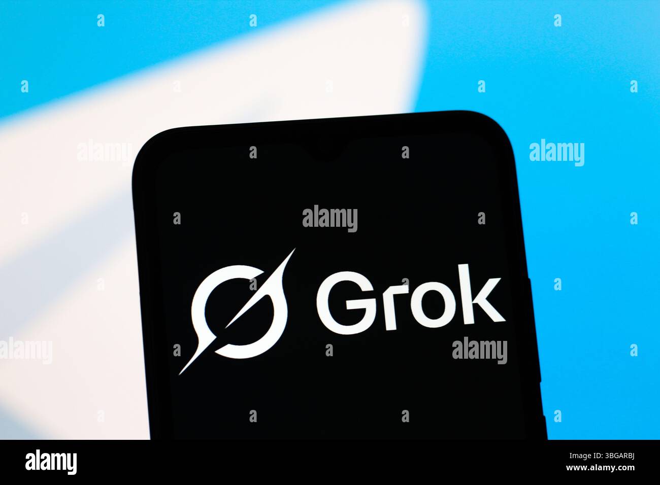 In this photo illustration, the Grok AI logo is seen displayed on a ...