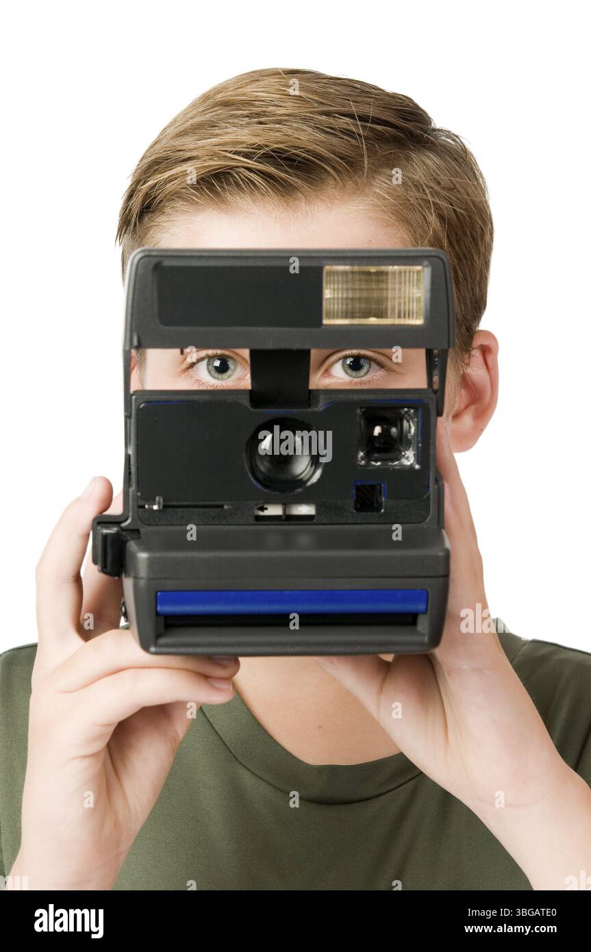 Frontal head and shoulder view of a 13-year-old teenager in front of a ...
