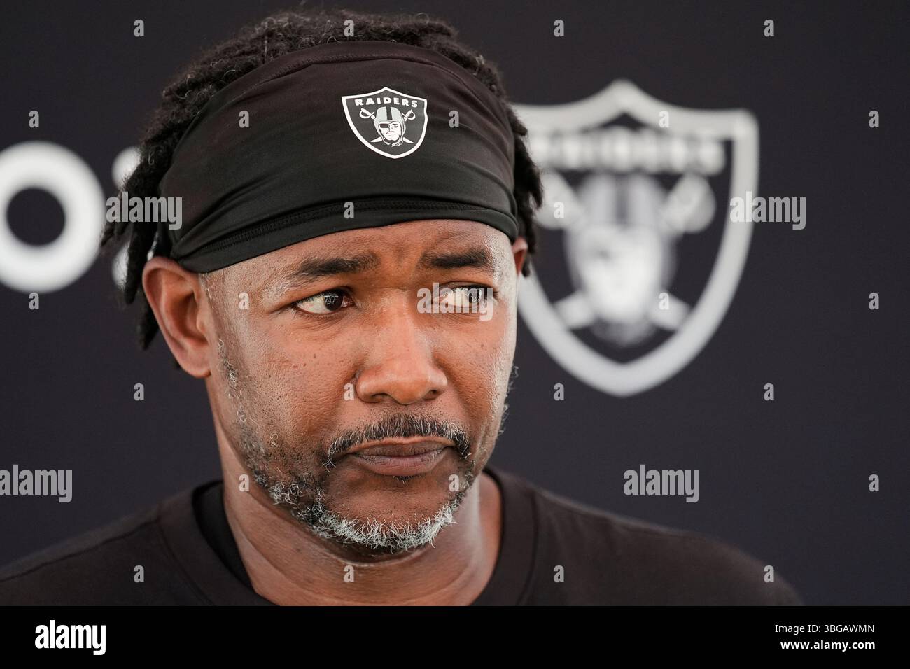 Las Vegas Raiders defensive coordinator Patrick Graham listens during a ...