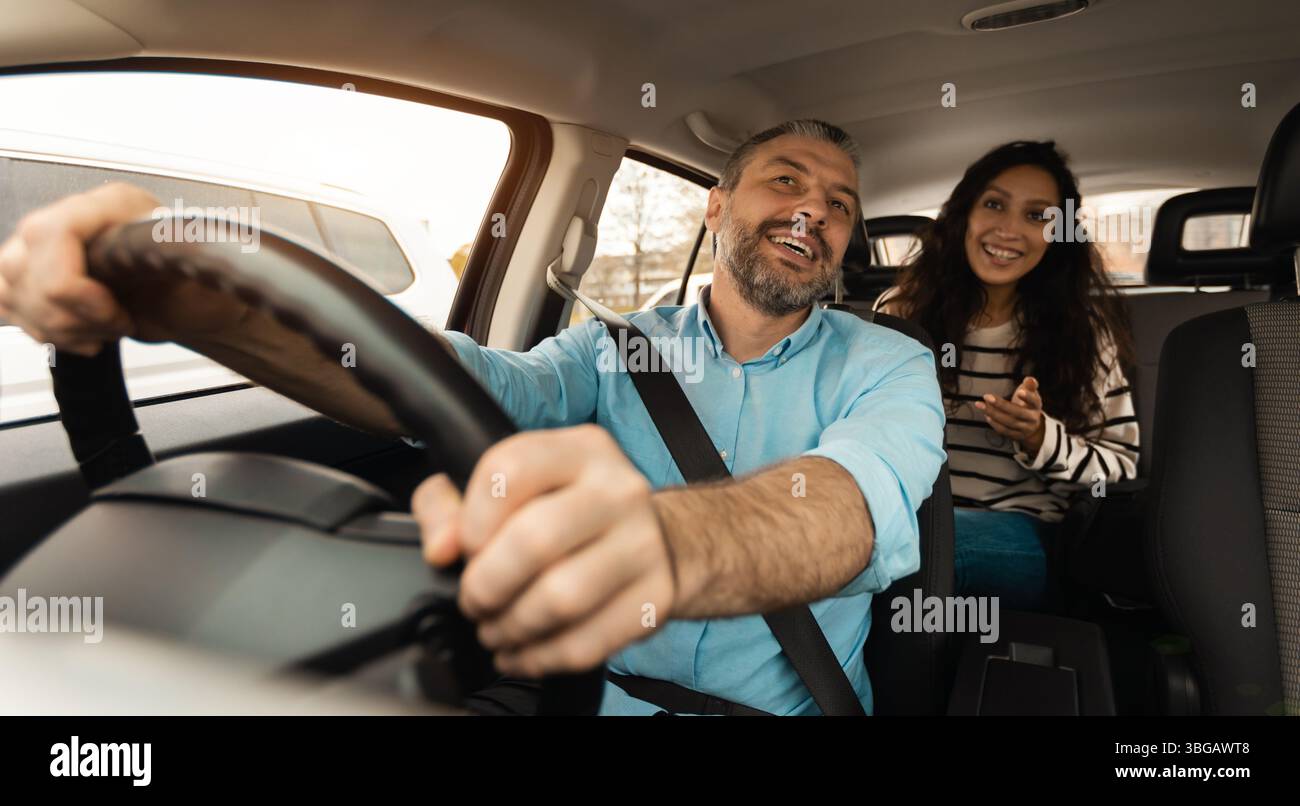 Happy couple enjoying drive on new car Stock Photo - Alamy