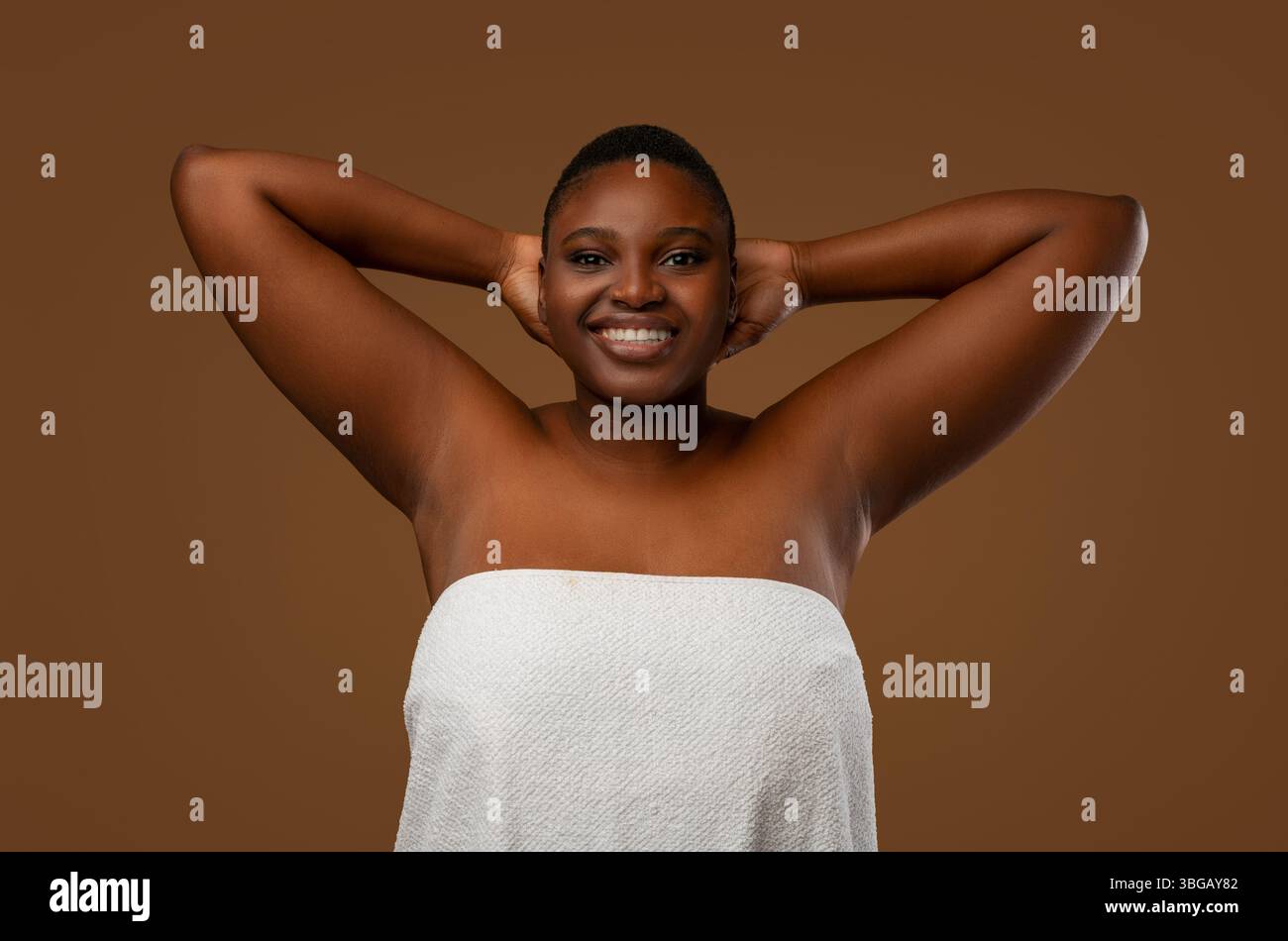 Portrait of beautiful plus size African american woman showing armpits ...