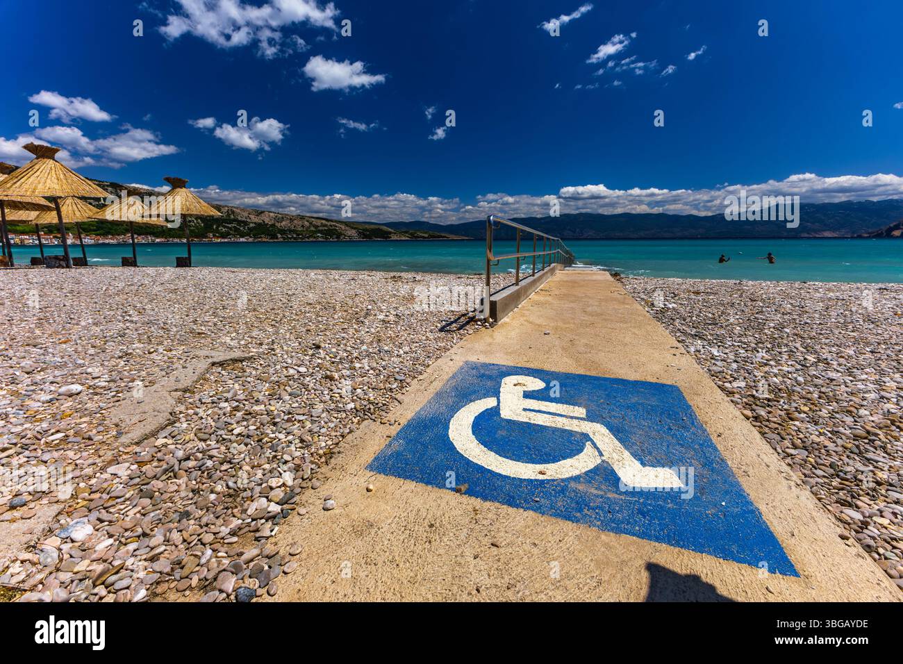 Beach adapted for disabled people moving in wheelchairs, concrete ...