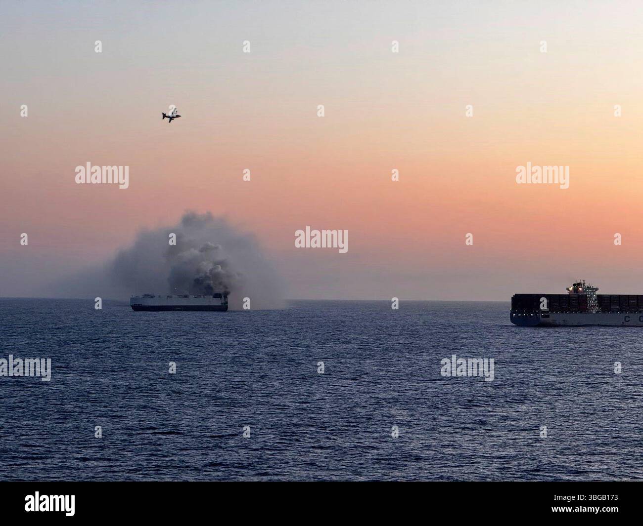 In this photo provided by the U.S. Coast Guard, smoke rises from the ...