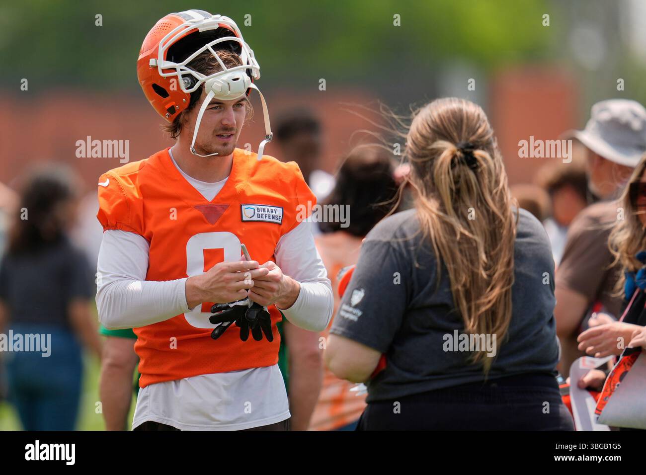 Cleveland Browns quarterback Kenny Pickett talks with fans as he walks ...