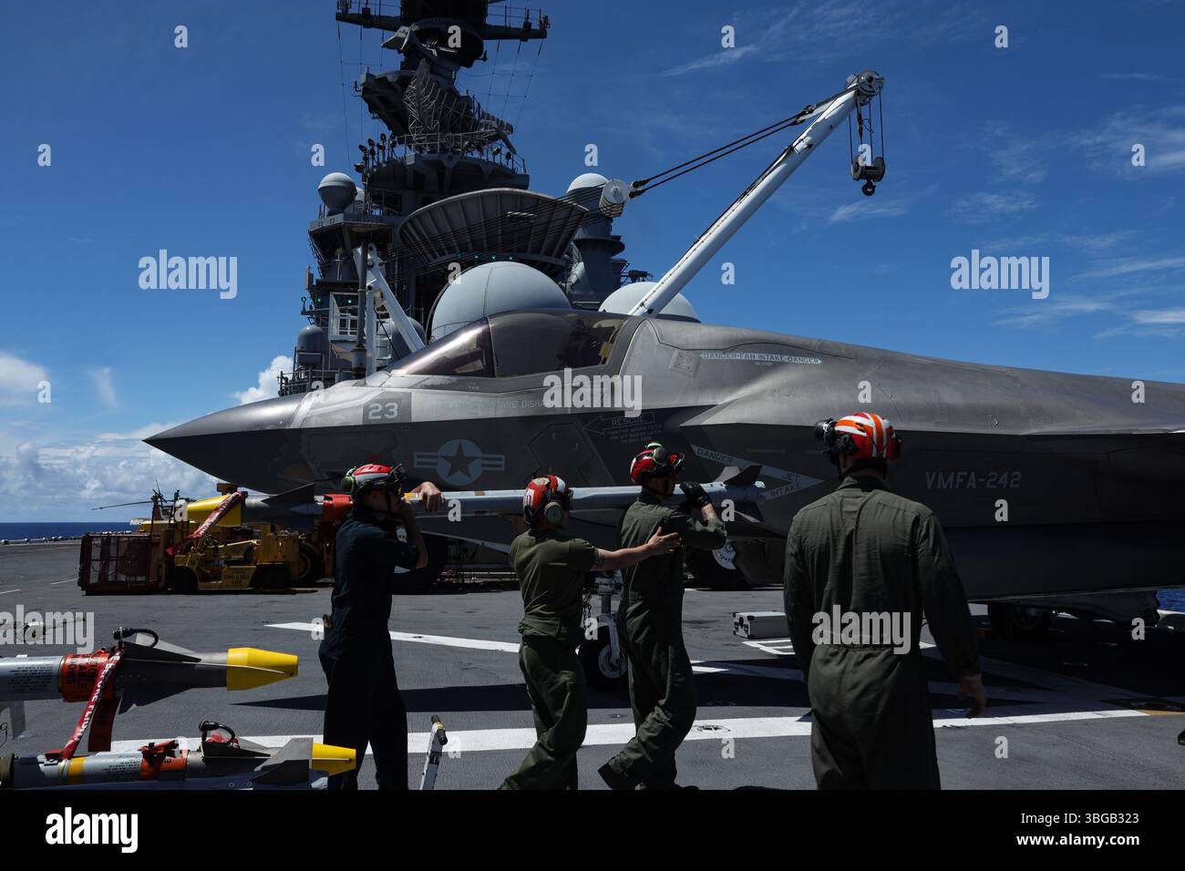 U.S. Marines load Air Intercept Missile-9X ordinance onto an F-35B Lightning II aircraft ...