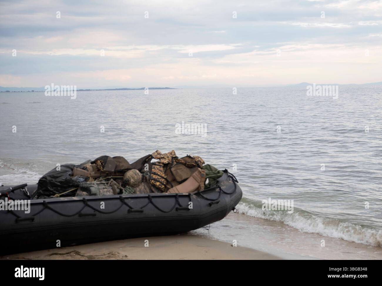 A Zodiac boat is loaded up with equipment before Soldiers with the 86th ...