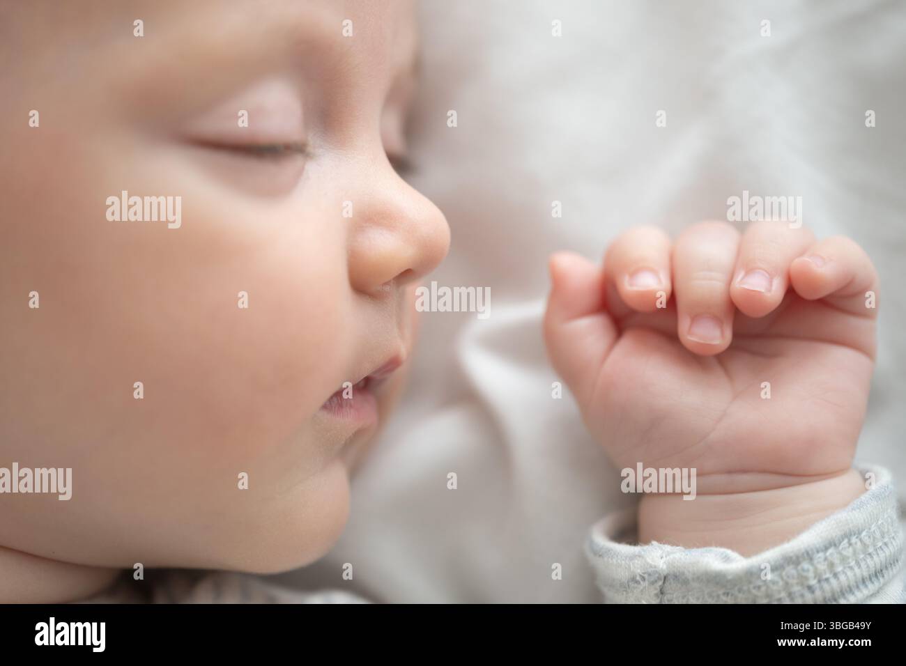 Newborn baby peacefully sleeping showcasing hi-res stock photography ...