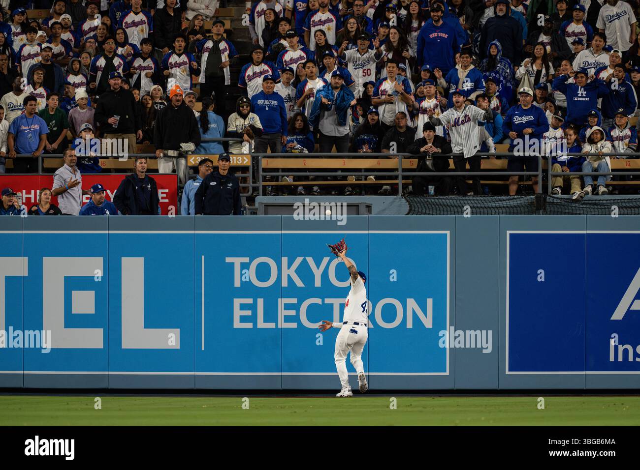 Los Angeles Dodgers outfielder Andy Pages (44) makes a catch during a ...