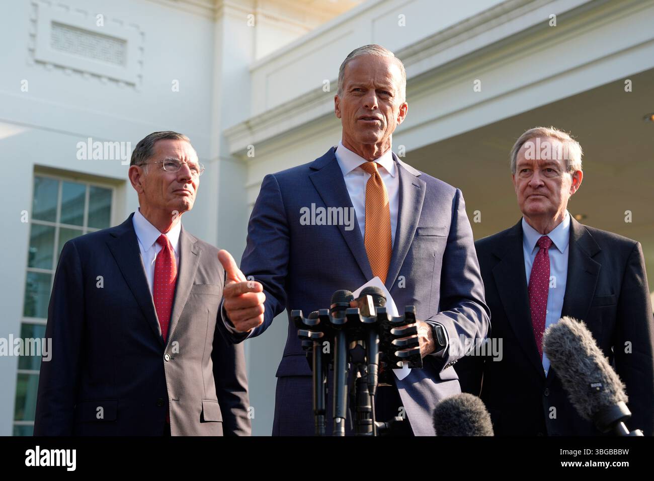 Senate Majority Leader John Thune, R-S.D.,, flanked by Sen. John ...