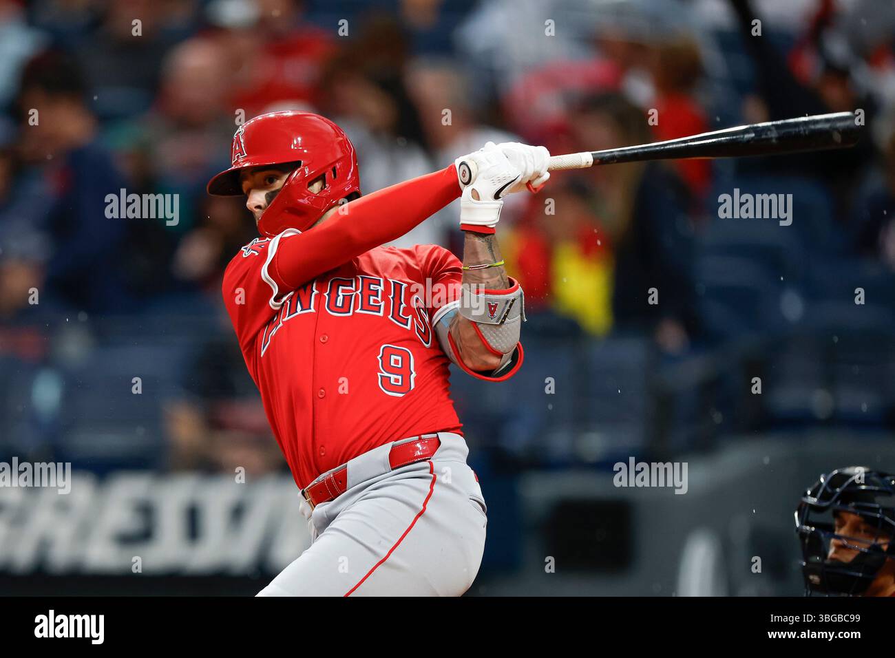 Zach Neto #9 of the Los Angeles Angels swings the bat during a game ...