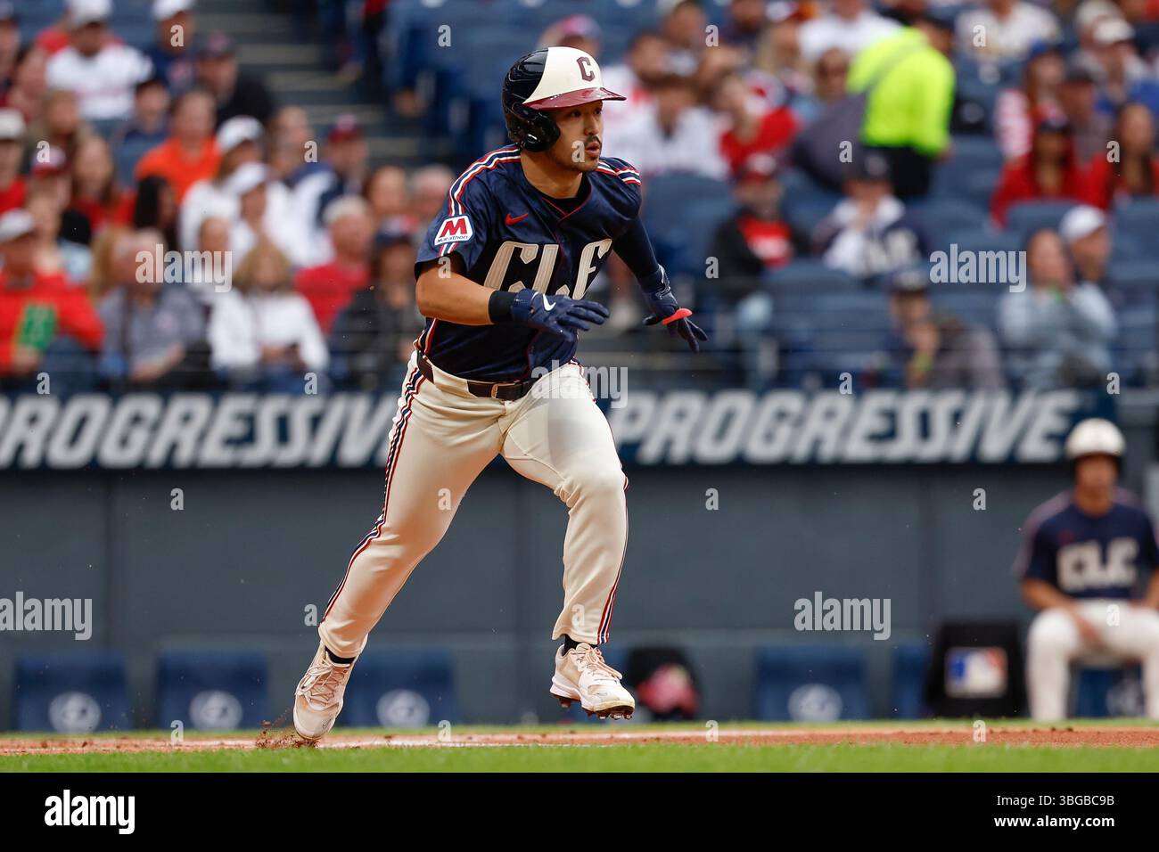 Steven Kwan #38 of the Cleveland Guardians runs to first base on a ...