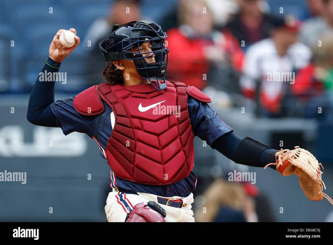 Bo Naylor #23 of the Cleveland Guardians throws a warm up toss during a ...