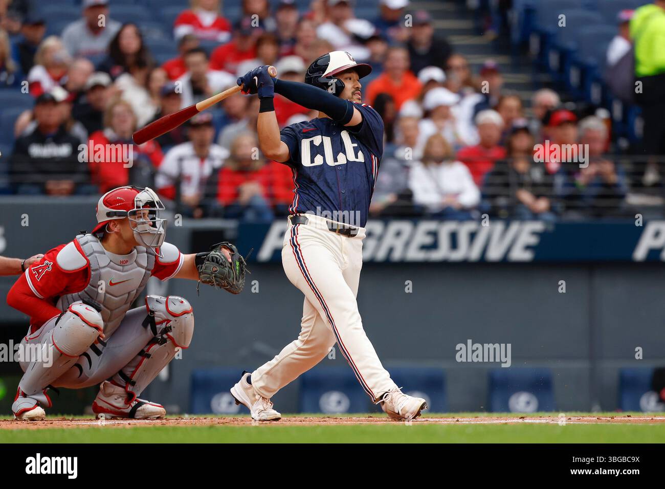 Steven Kwan #38 of the Cleveland Guardians swings the bat during a game ...