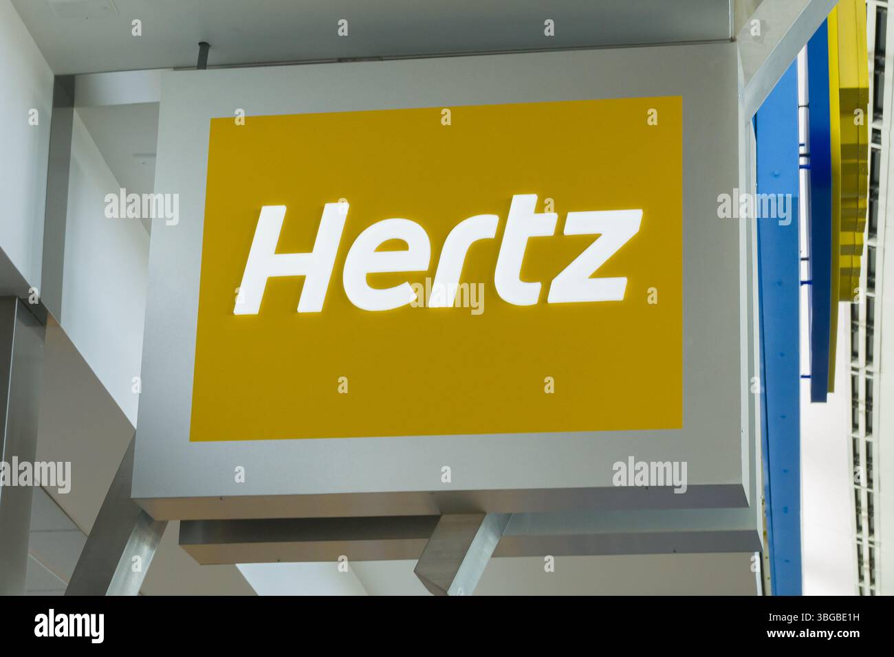 SEATTLE, WA, USA, MAY 24, 2025: Hertz car rental car sign and trademark ...