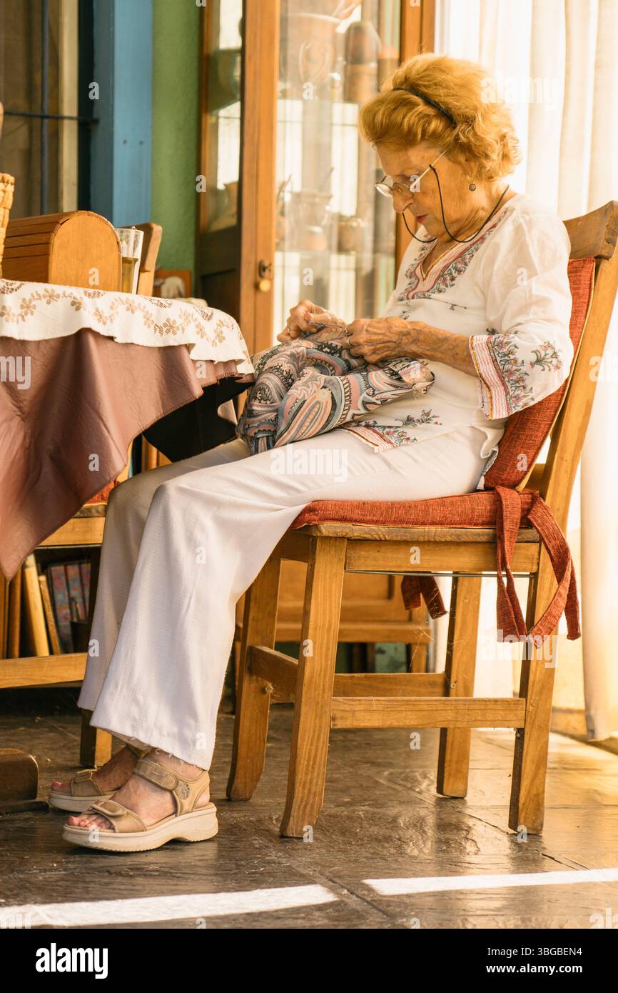 Woman sitting creating handmade hi-res stock photography and images - Alamy