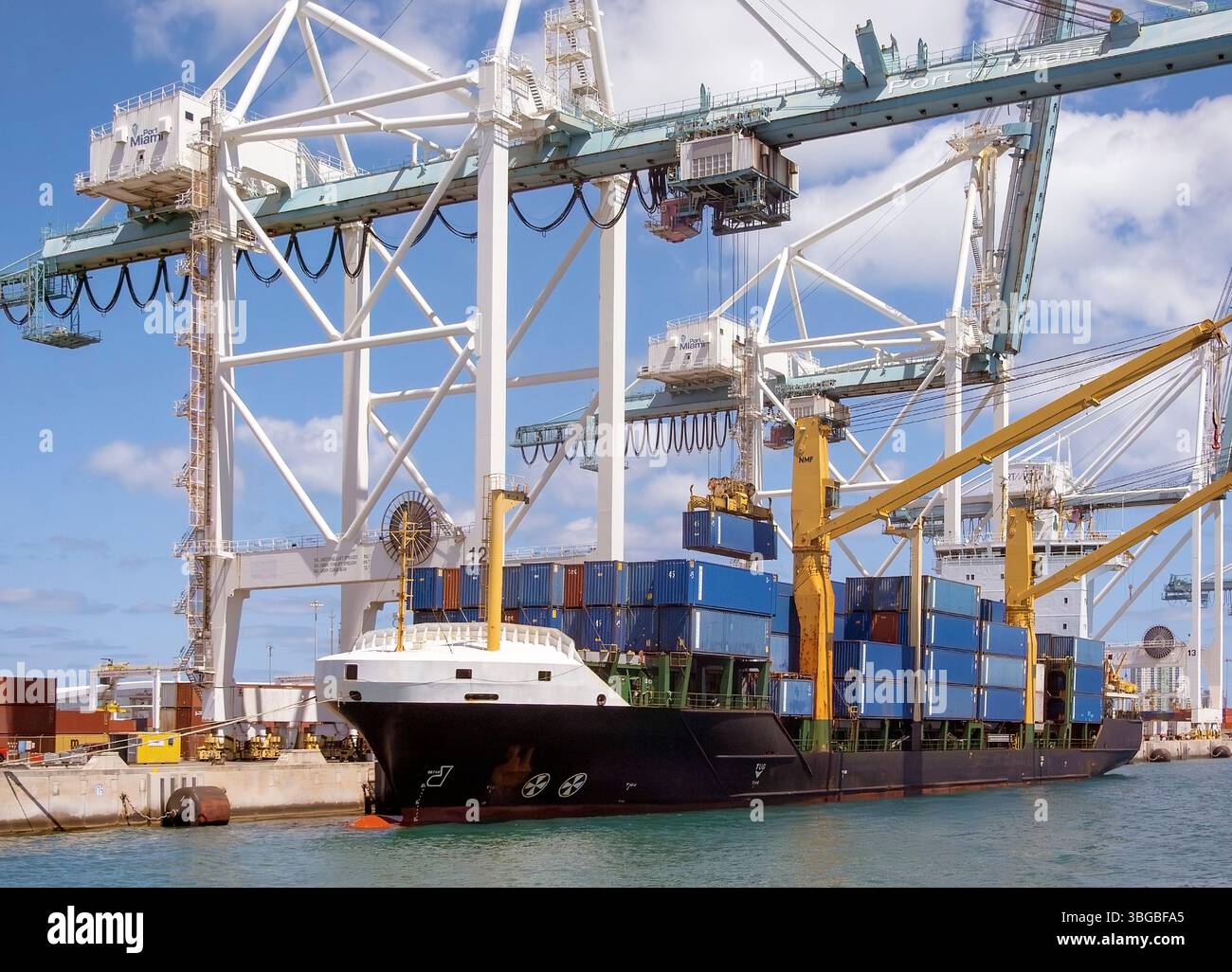 Container being loaded onto a ship Miami, Florida, USA Stock Photo - Alamy