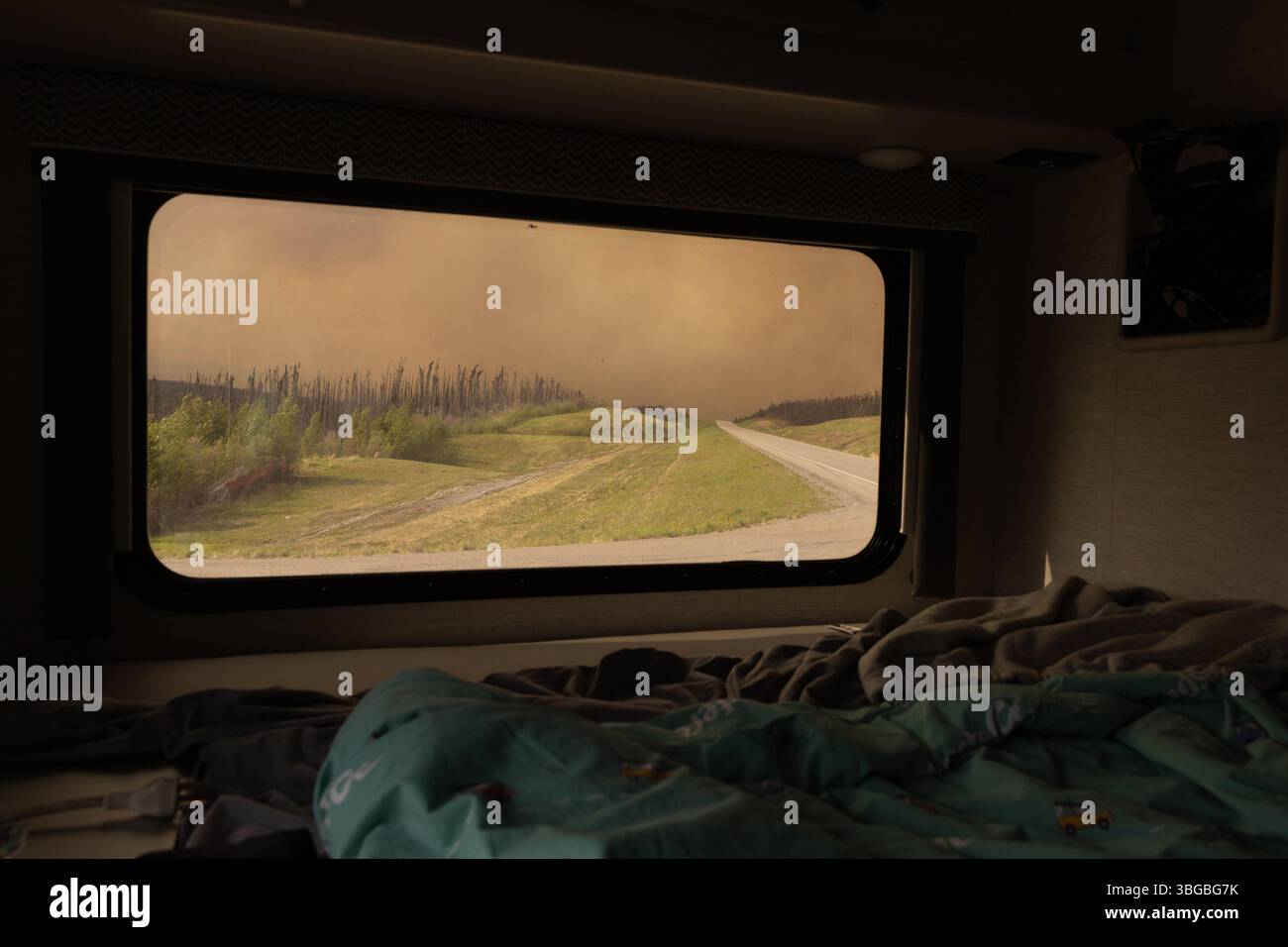 Wildfire smoke is seen on Highway 97 north of Buckinghorse River, B.C ...