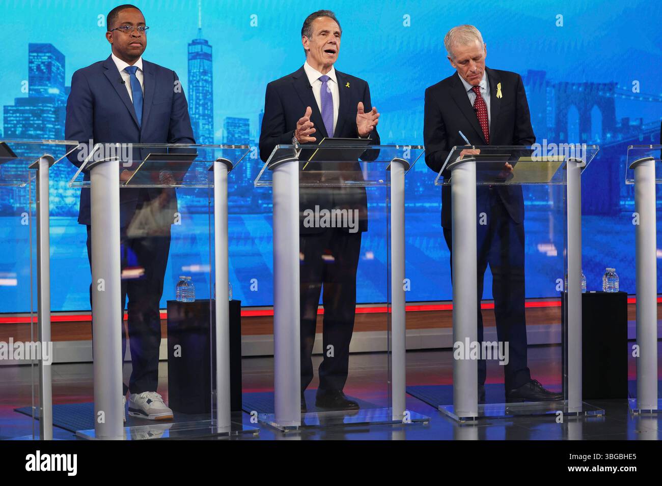 Andrew Cuomo, center, speaks during a Democratic mayoral primary debate ...