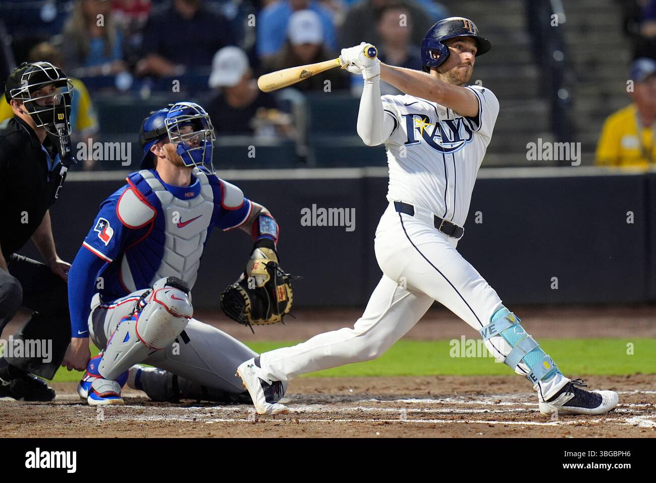 Tampa Bay Rays' Brandon Lowe watches his RBI double off Texas Rangers ...