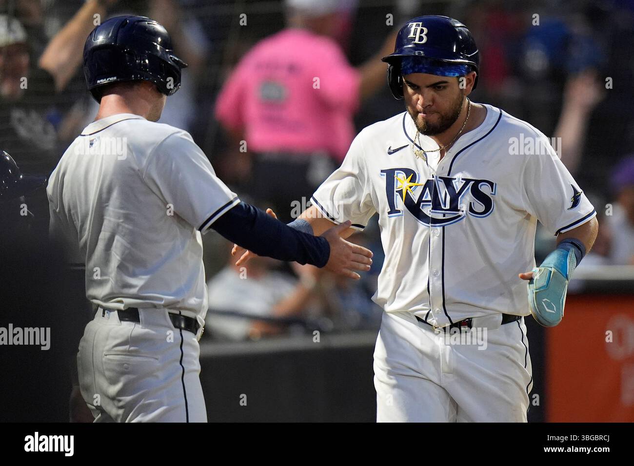 Tampa Bay Rays' Jonathan Aranda, right, celebrates after scoring on a ...