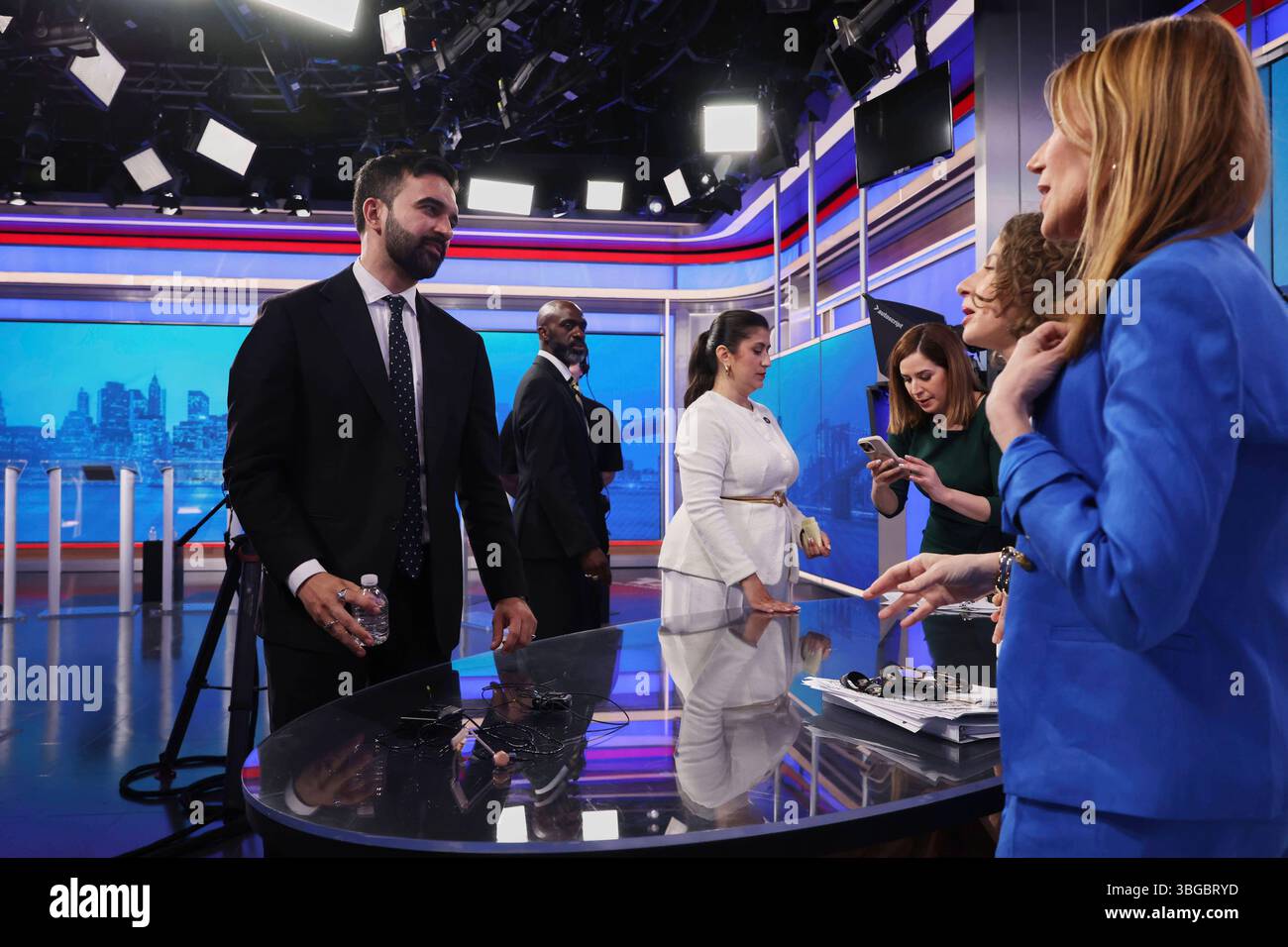 Democratic mayoral candidate Zohran Mamdani talks with debate ...