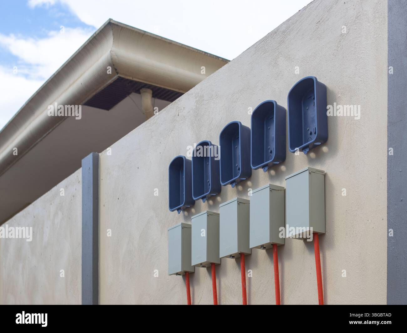 plastic boxes for electric meters on the wall Stock Photo - Alamy