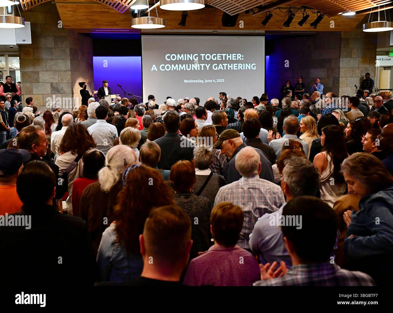 Participants gather at a vigil at the Boulder Jewish Community Center ...