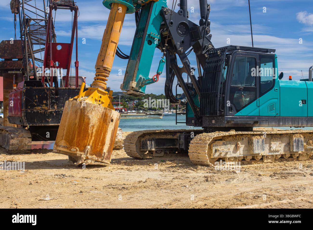 An excavator with a drilling bucket (drill bit) with hard alloy ...