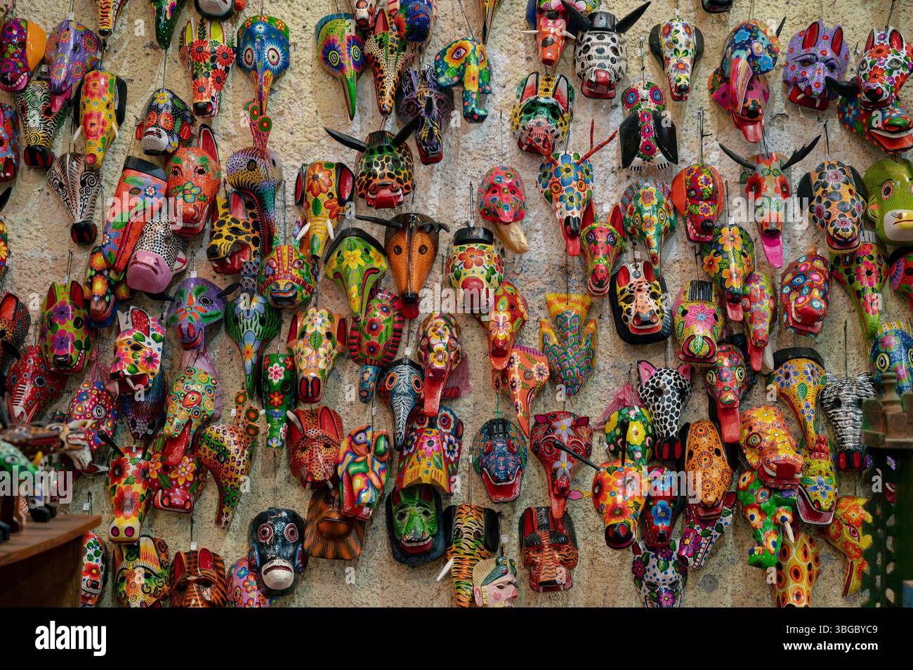 Colorful wooden masks wall in Guatemala market Stock Photo - Alamy