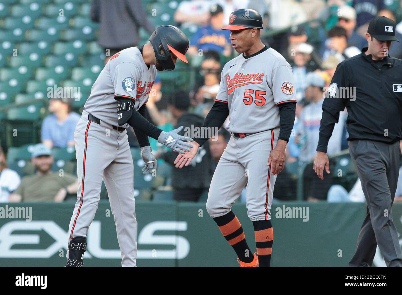 Baltimore Orioles' Dylan Carlson, left, celebrates with first base ...