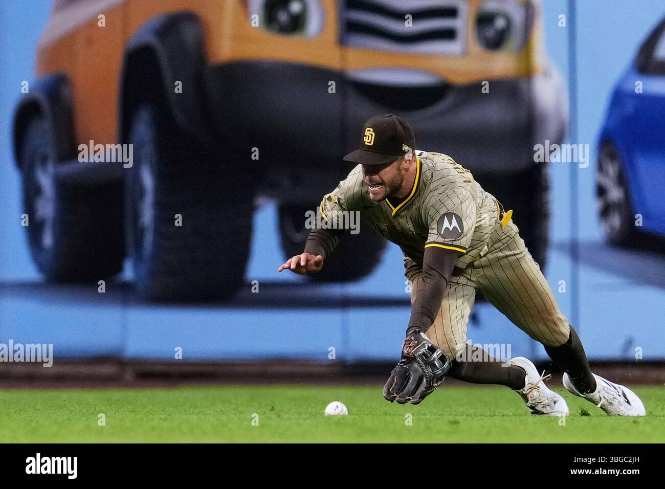 San Diego Padres left fielder Brandon Lockridge is unable to catch a ...