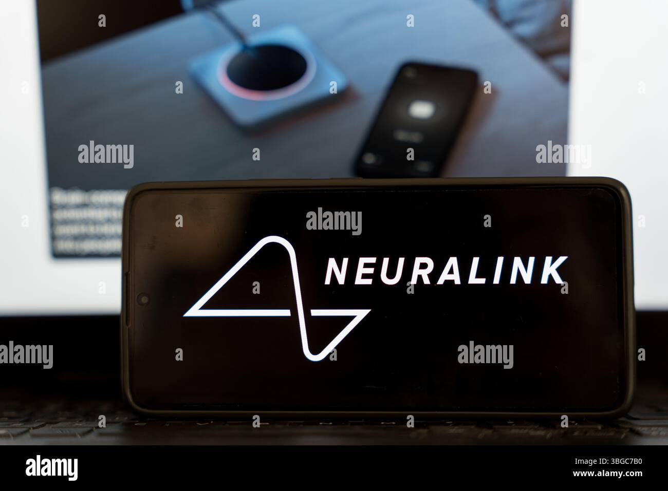 Smartphone screen showing Neuralink logo with background related to ...