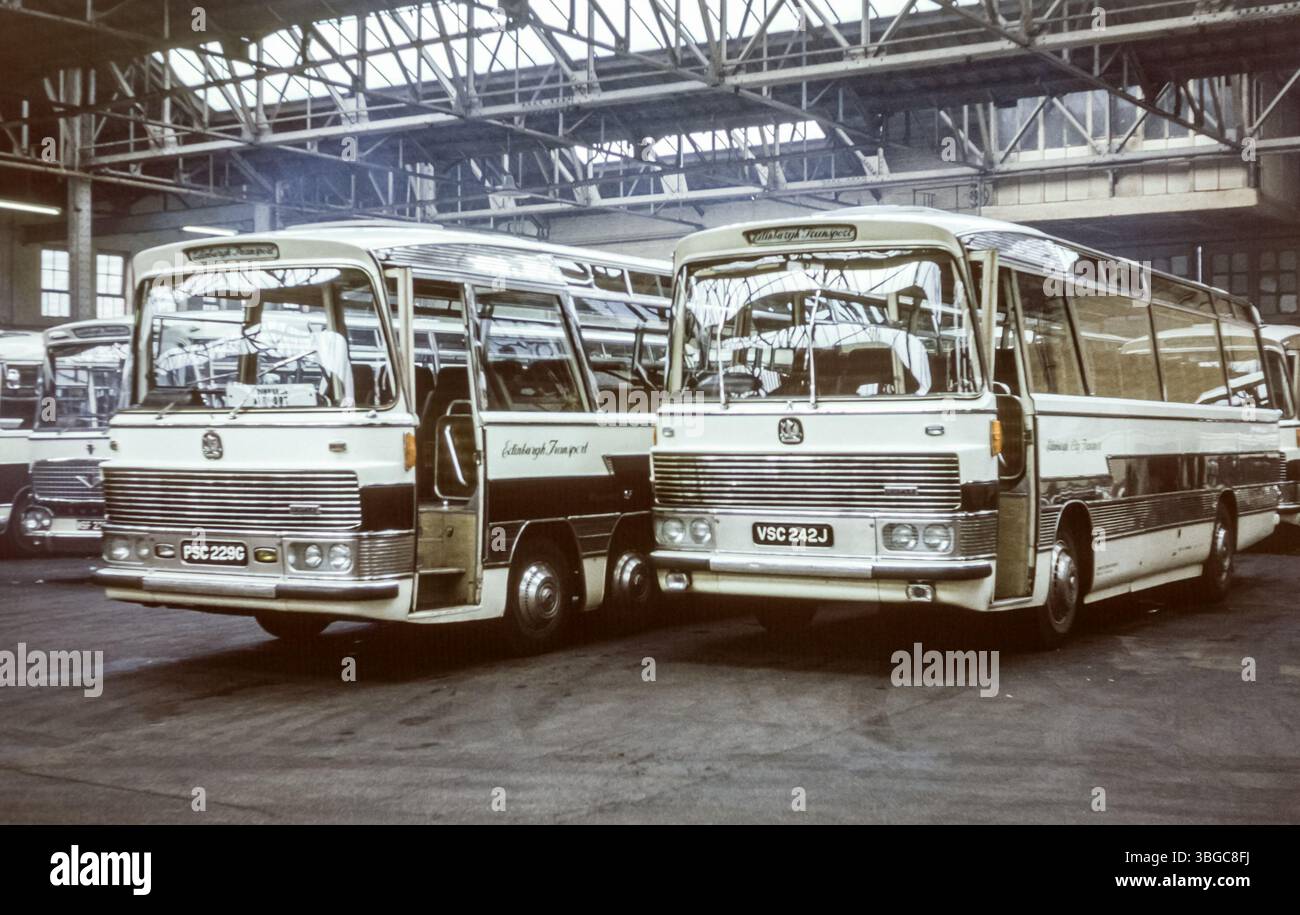 Scotland, UK - 1973: Vintage image of two buses in a bus depot. Owned ...