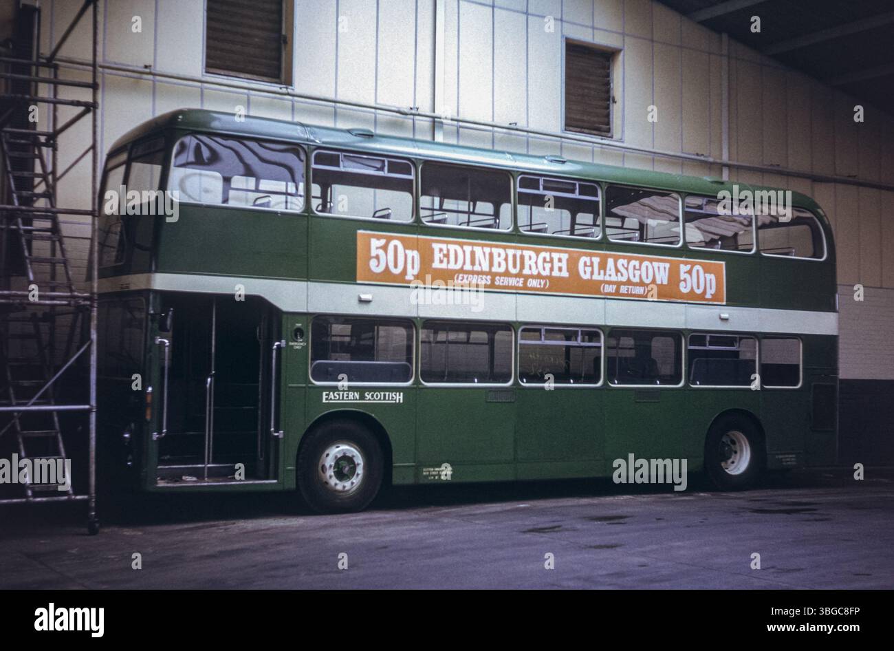Scotland, UK - 1973: Vintage image of a bus in a bus depot. Owned by ...