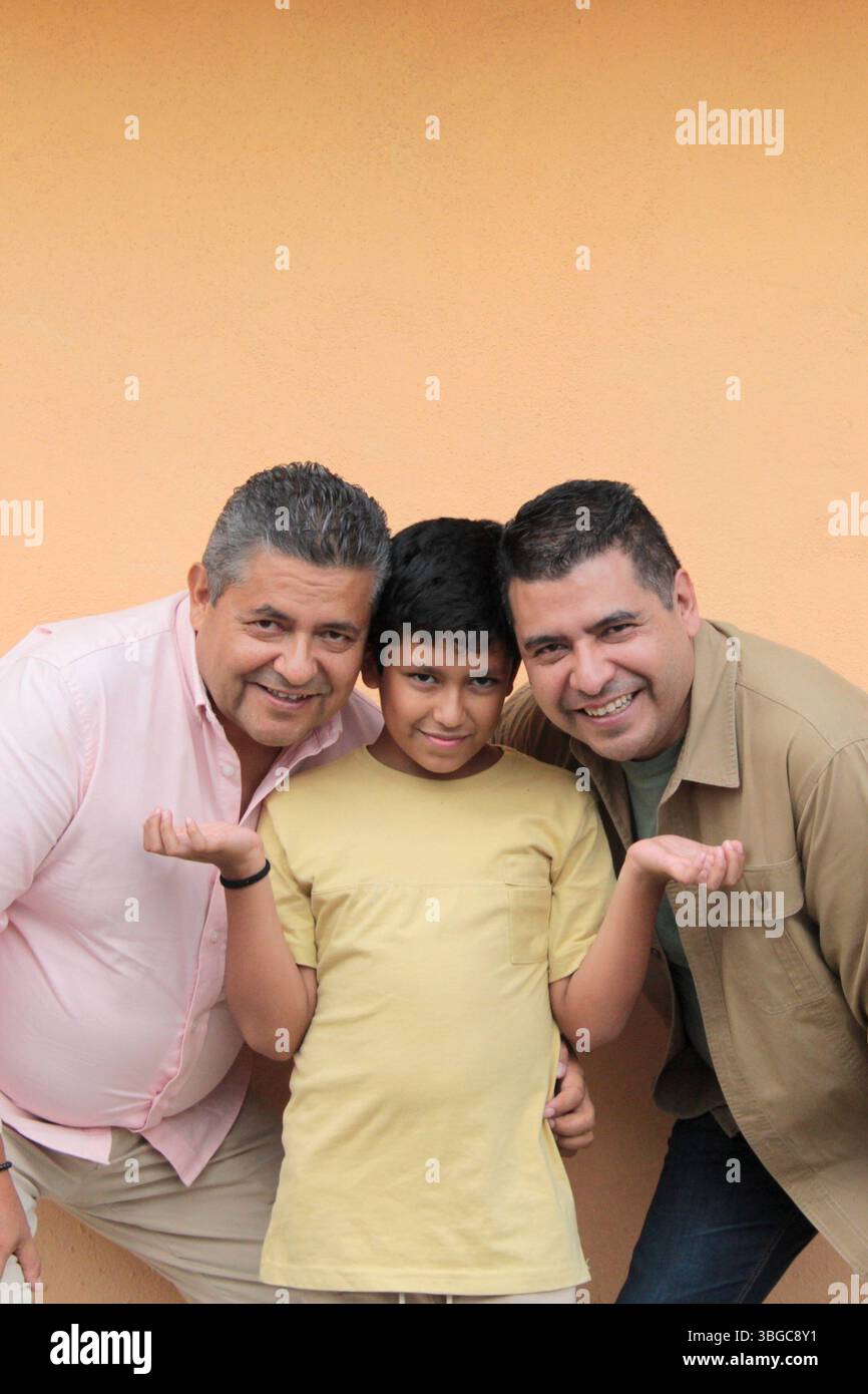 Three generations of a dark-skinned Latino grandfather, father, and son ...