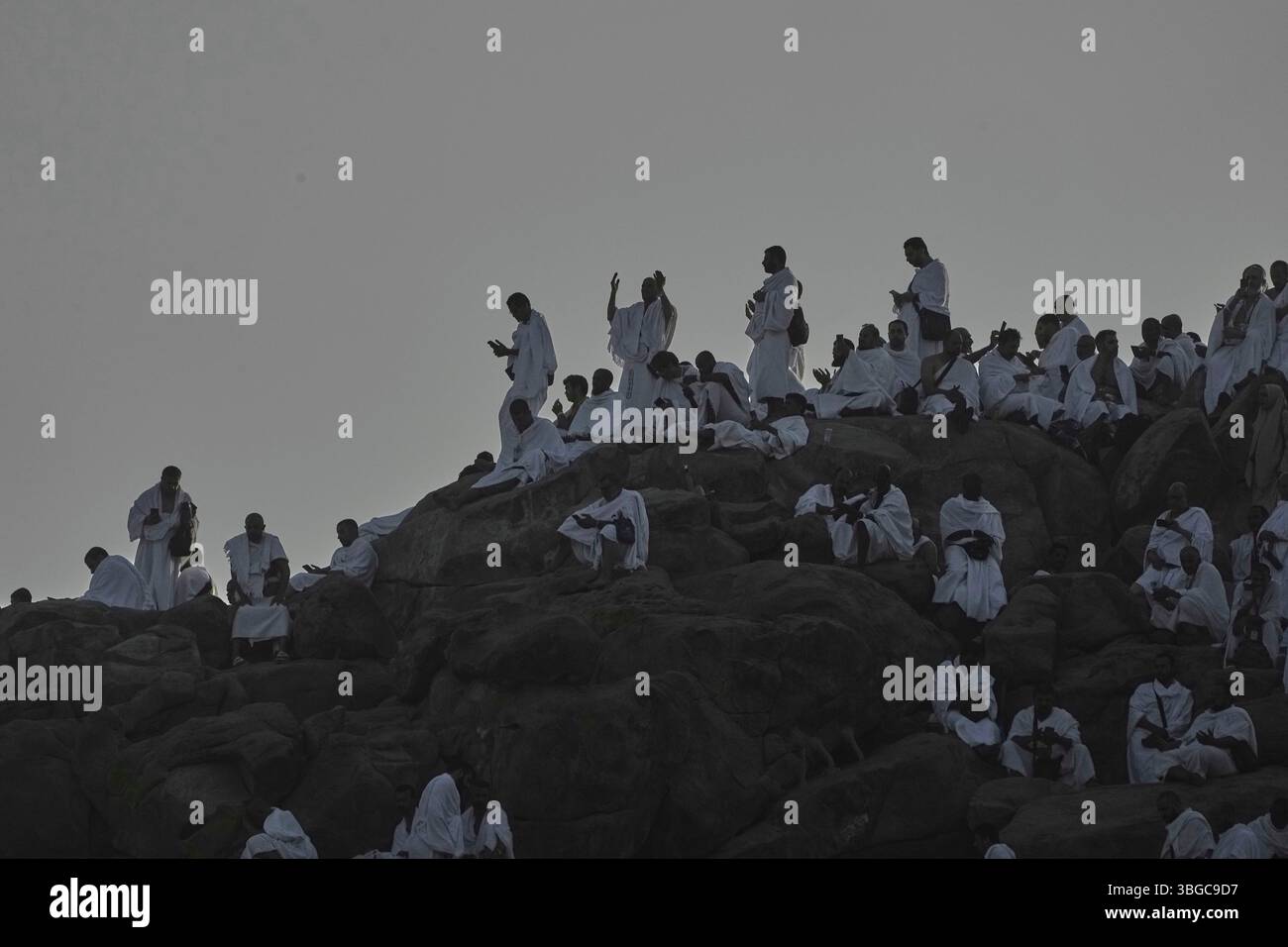 Muslim pilgrims pray a top of the rocky hill known as the Mountain of ...